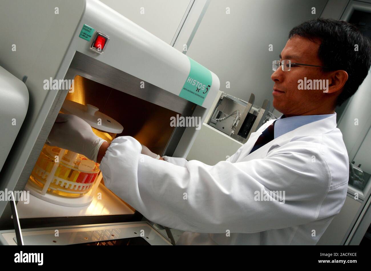 Microwave histology processor. Scientist using a Histos 5 rapid ...