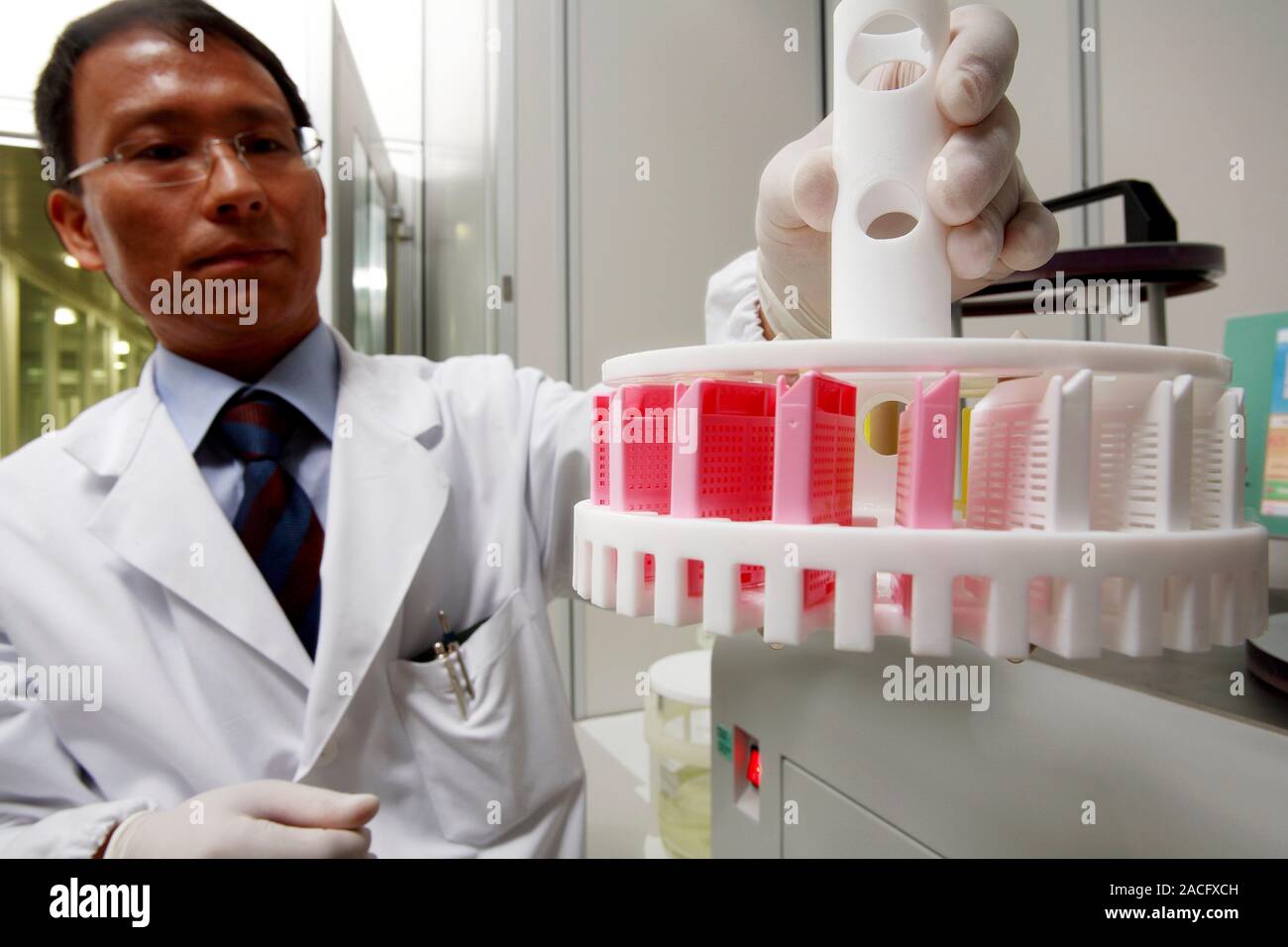 Microwave histology processor. Scientist preparing histology specimens ...