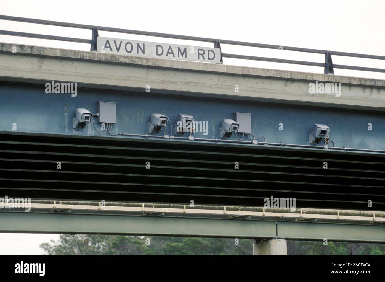 Road safety system. The cameras on this road bridge are part of the ...