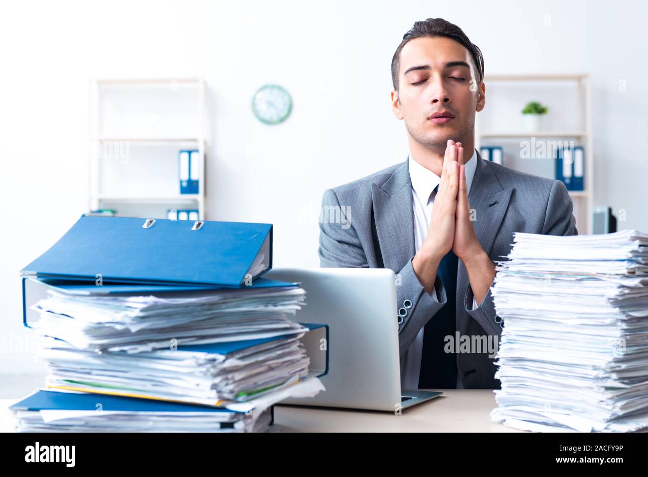 The businessman with heavy paperwork workload Stock Photo - Alamy