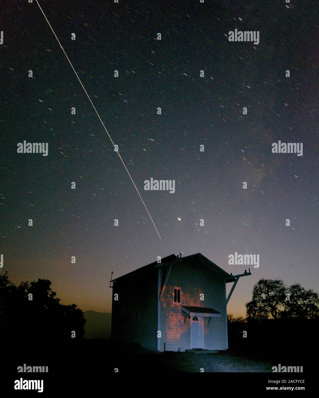 International Space Station (ISS), time-exposure image. The trail of ...