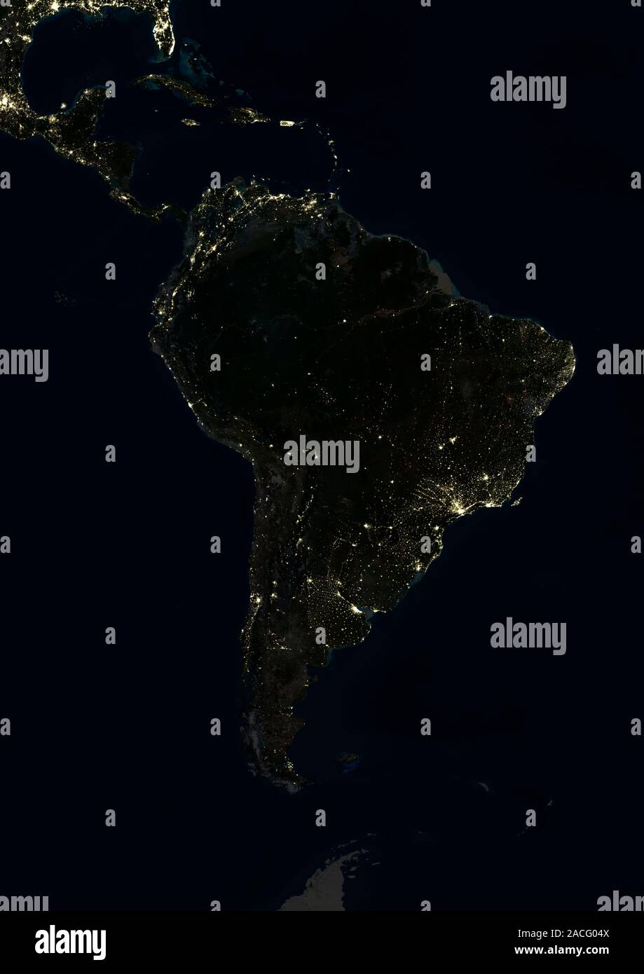 South America at night, satellite image. City lights (yellow) of ...