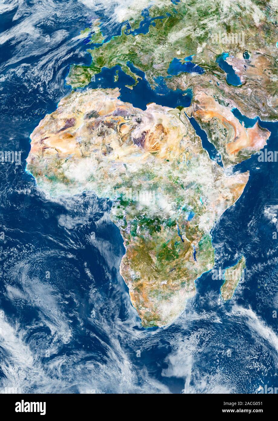 Africa with clouds, satellite image. The land is mostly covered by ...