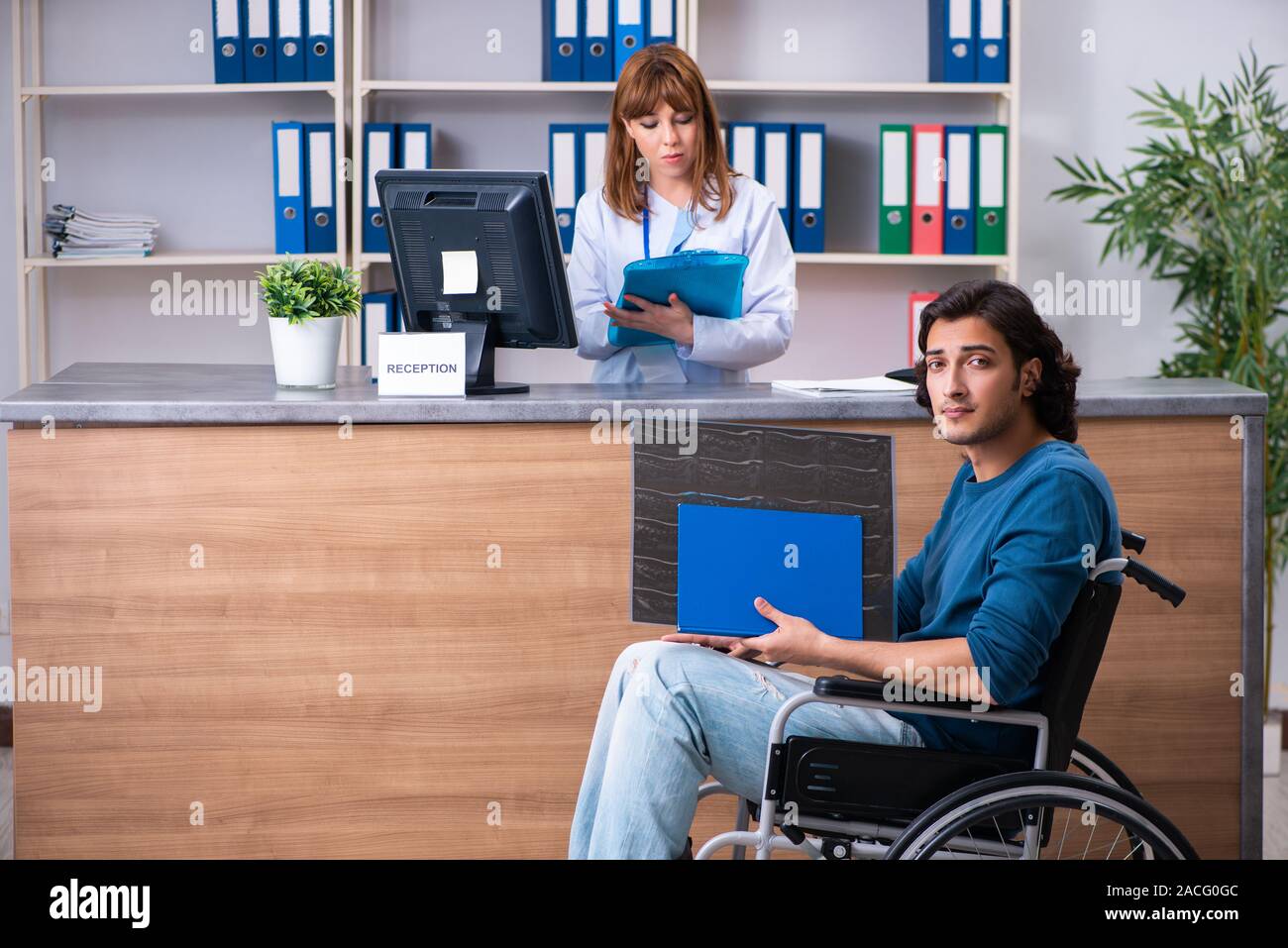 The young patient at the reception in the hospital Stock Photo - Alamy