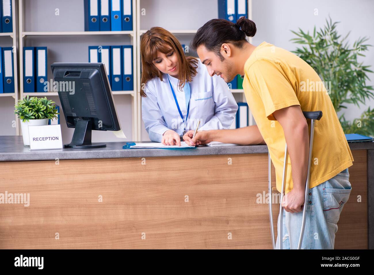 The young patient at the reception in the hospital Stock Photo - Alamy