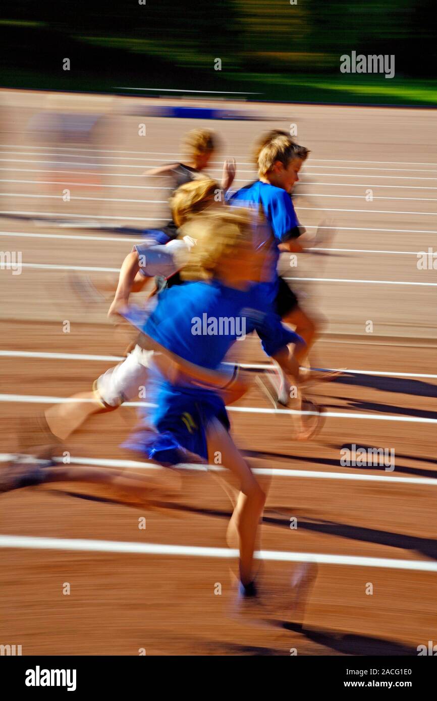 School athletics. 12-year-old and 13-year-old children competing in a ...