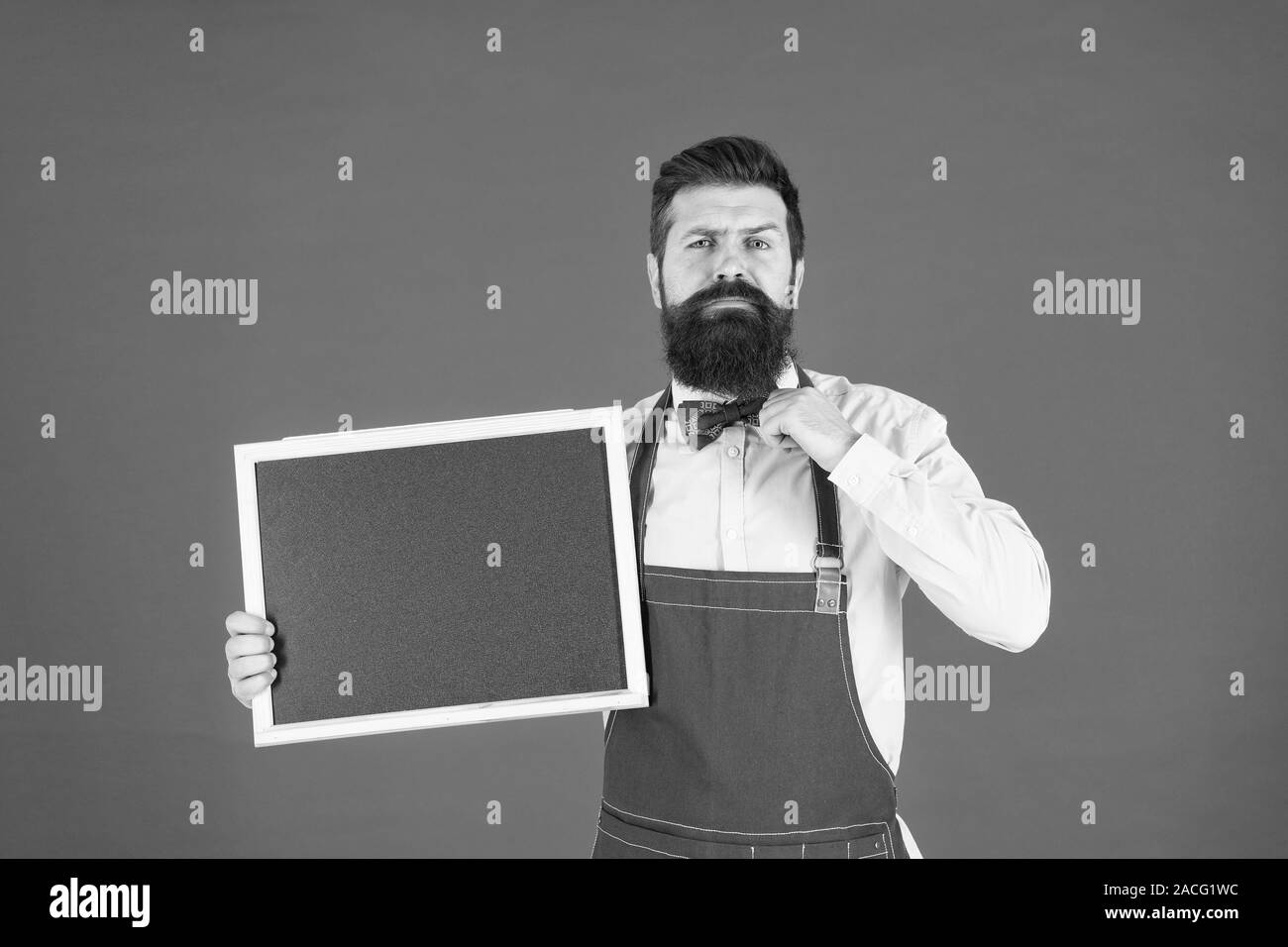 Handsome man showing red Black and White Stock Photos & Images - Alamy