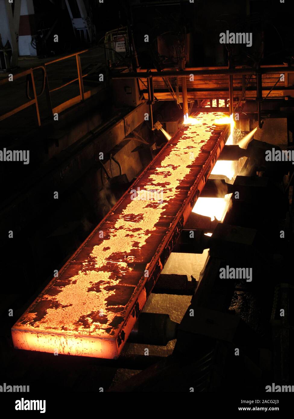 Molten steel bars being produced inside a metal working plant Stock ...