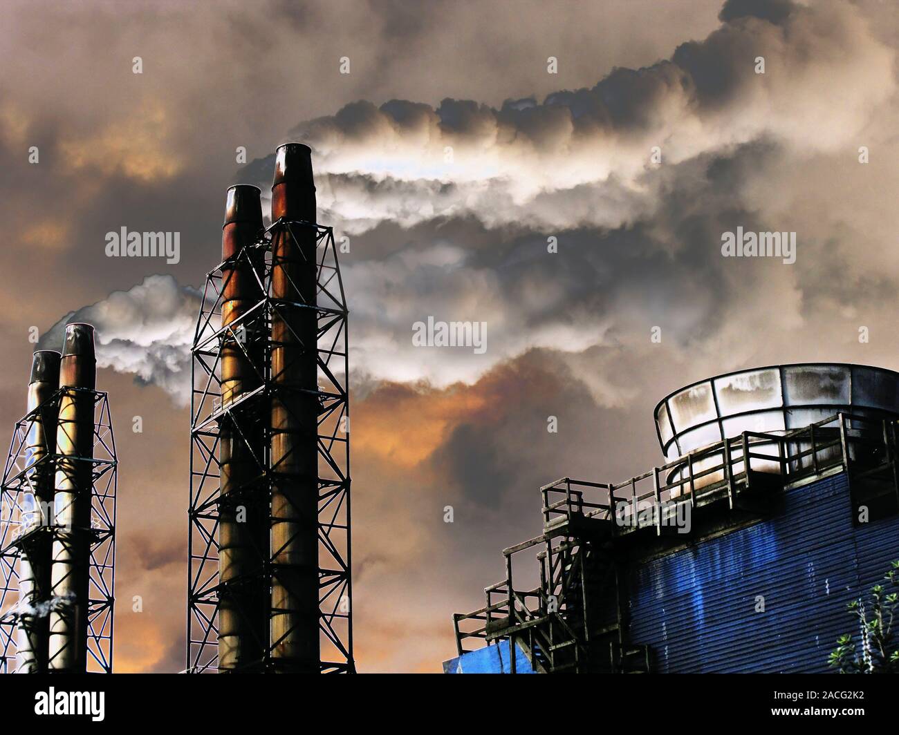 Industrial air pollution. Smoke billowing from a steel mill's chimney ...