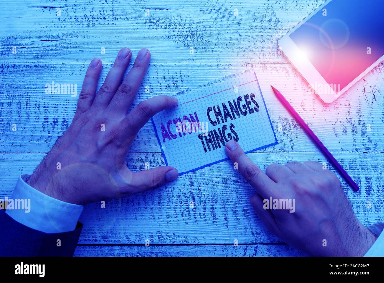 Writing note showing Action Changes Things. Business concept for doing ...