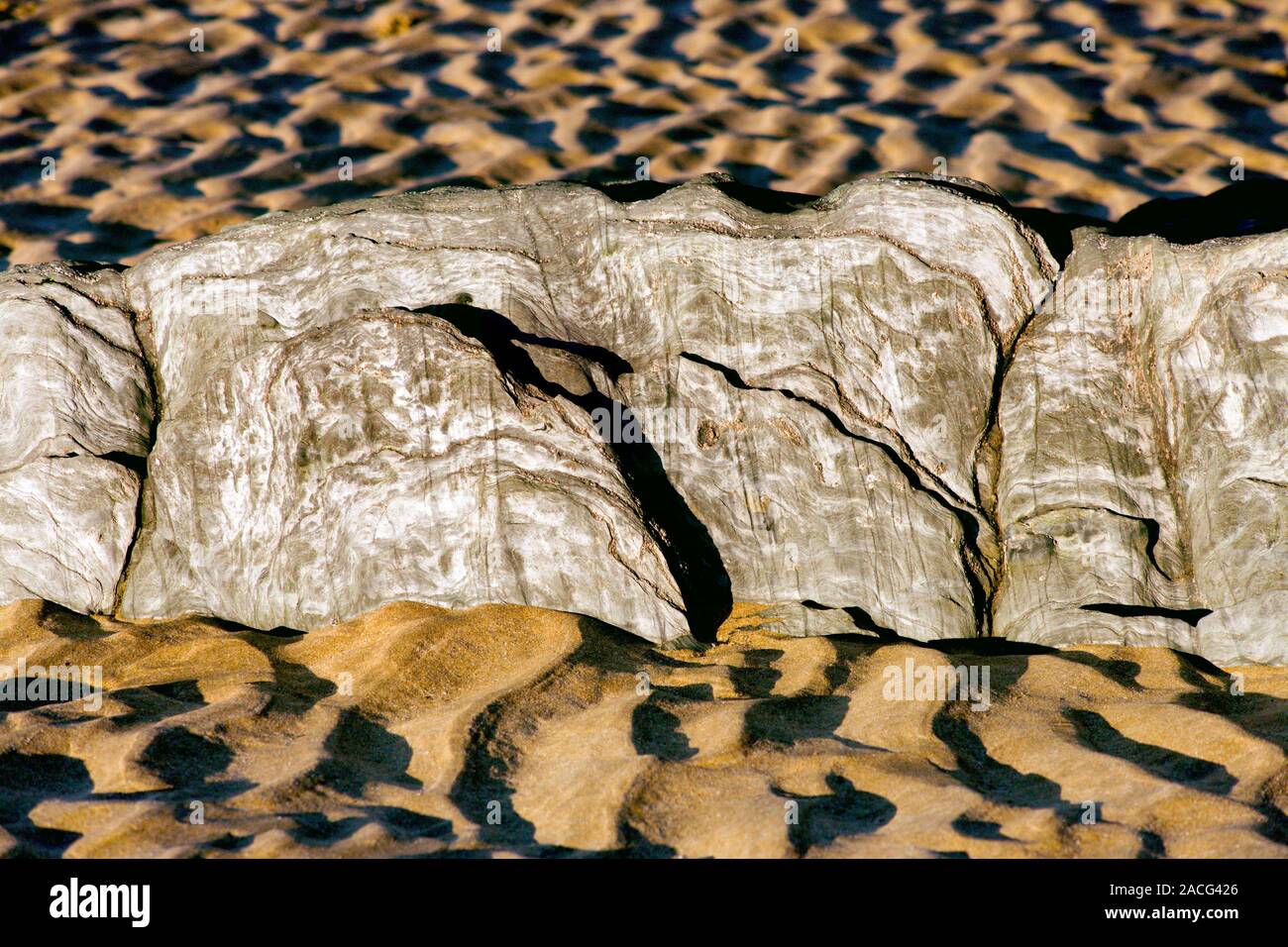 Sand patterns at low tide. Patterns in the sand caused by the flow and ...