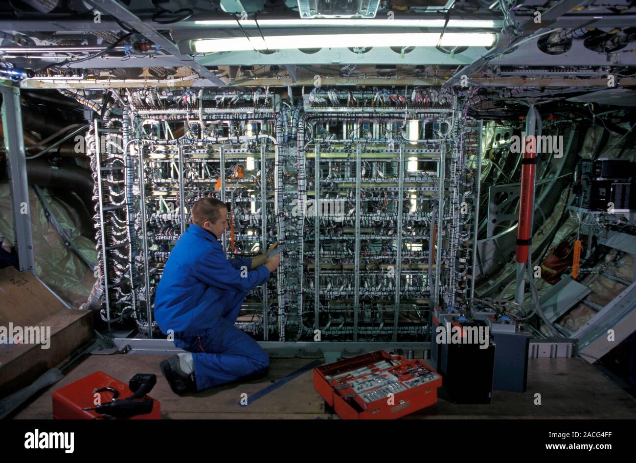 Passenger aircraft construction. Technician in the electrical service ...