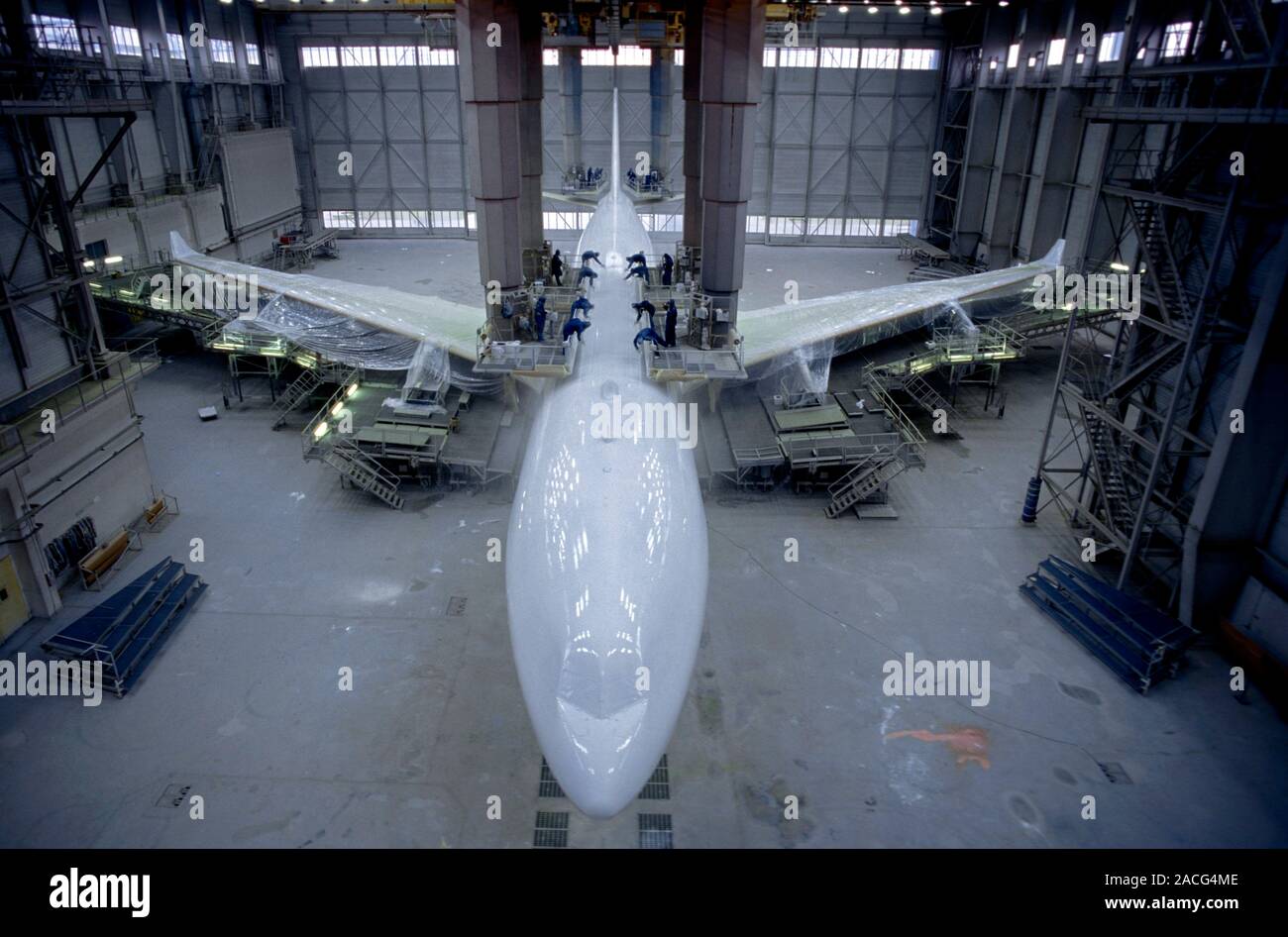 Passenger aircraft construction. Airbus A340 in a painting hangar ...