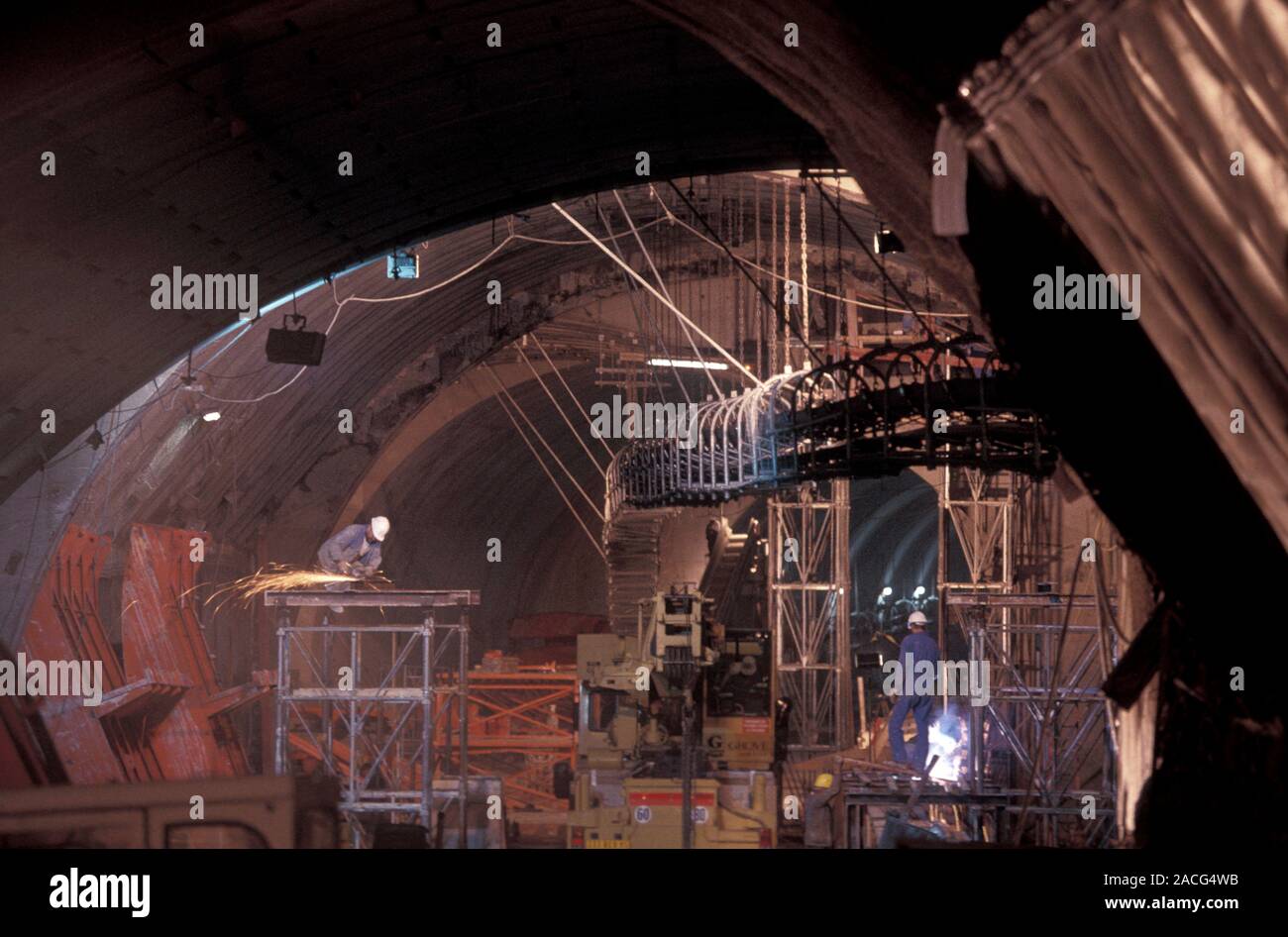 Metro train tunnel construction. Workers carrying out a variety of ...