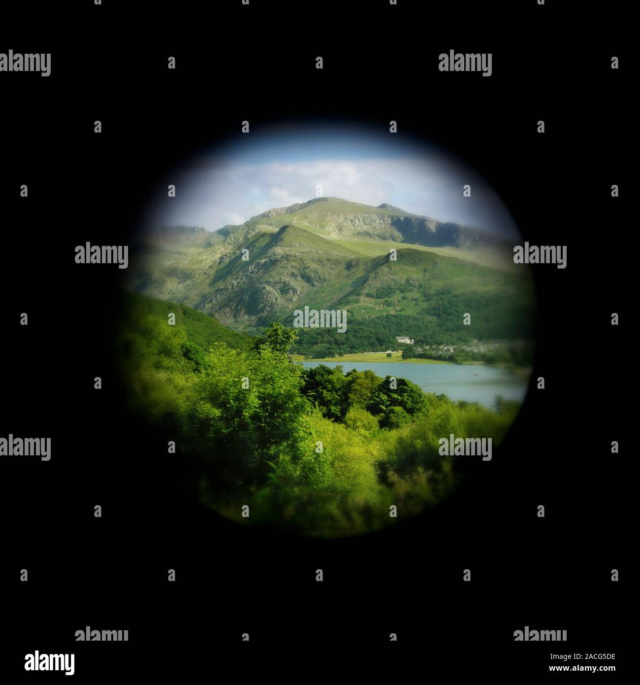 Glaucoma. Patient's-eye view of mountainous countryside, in a patient ...
