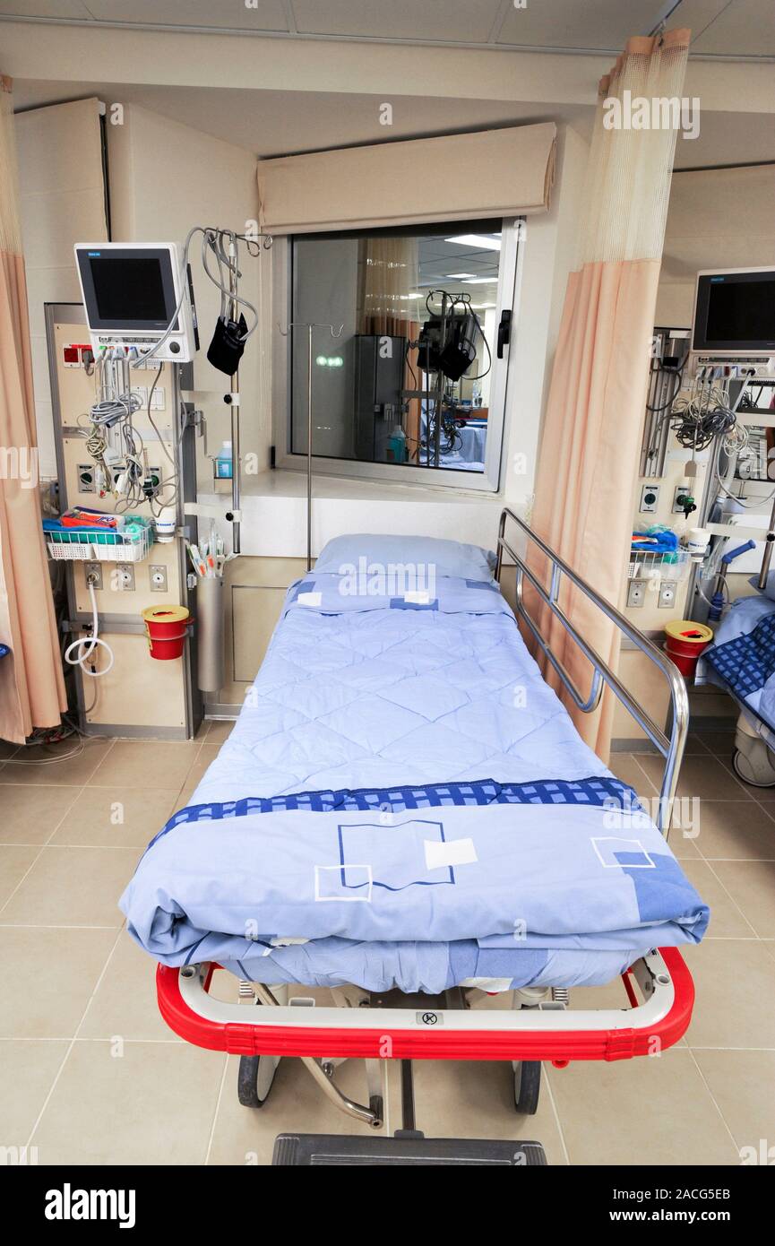 Hospital intensive care unit bed, with associated equipment Stock Photo ...
