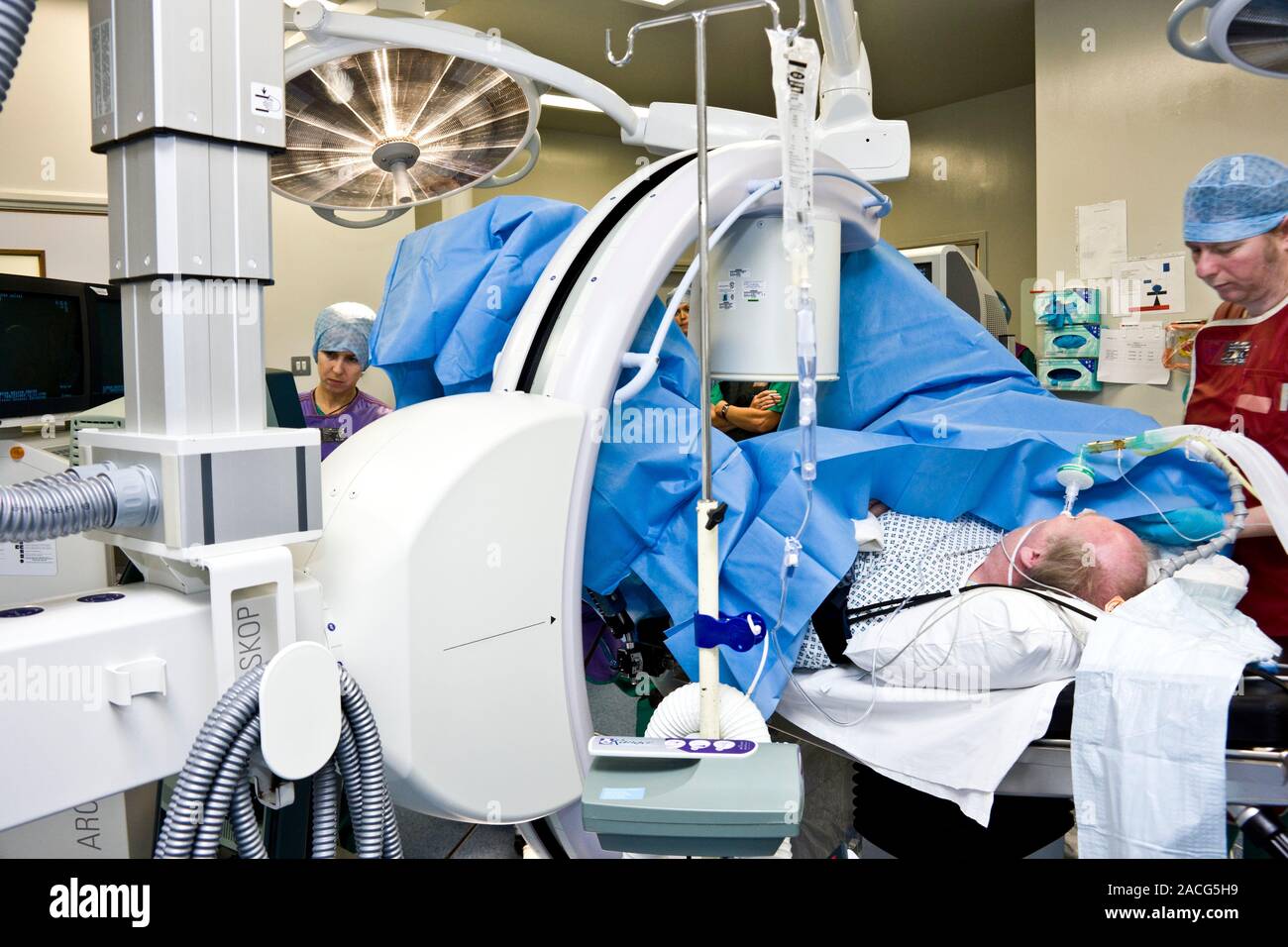 Prostate cancer radiotherapy surgery. Patient under general anaesthetic ...