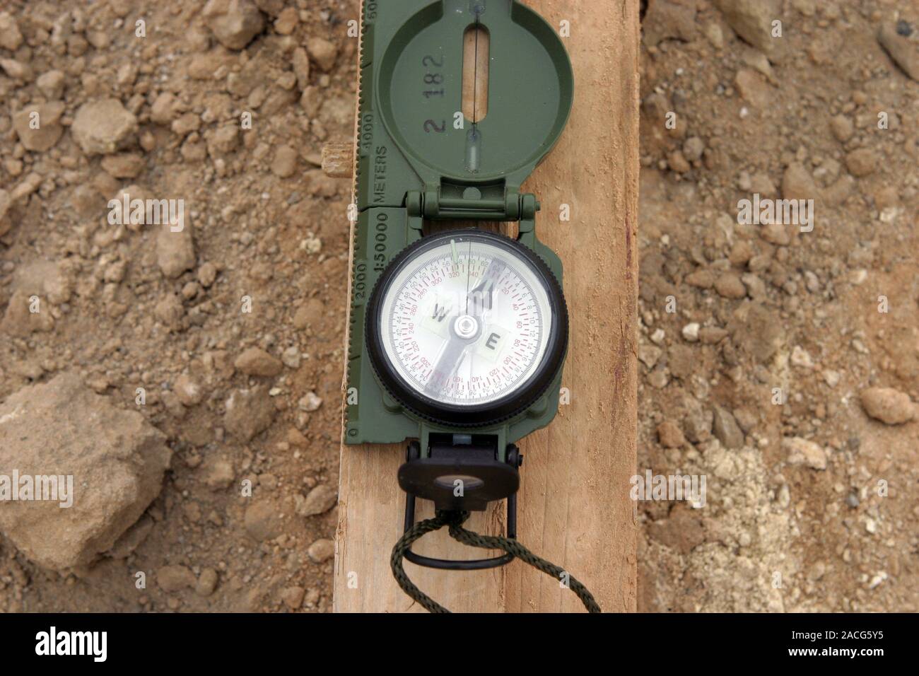 Military compass. This compass is being used to help determine the ...