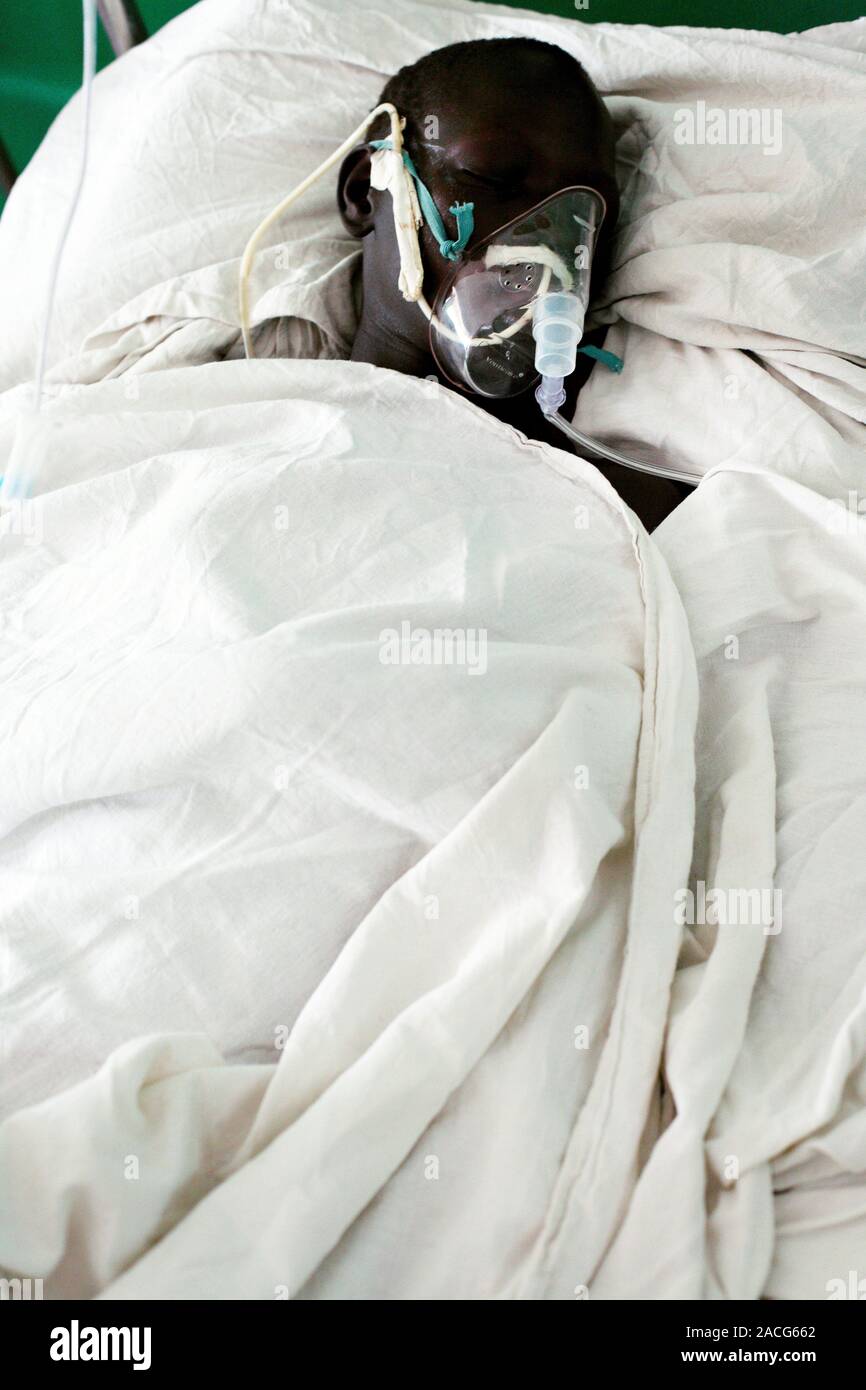 Hospital patient. The patient is sedated or sleeping, and is using an ...