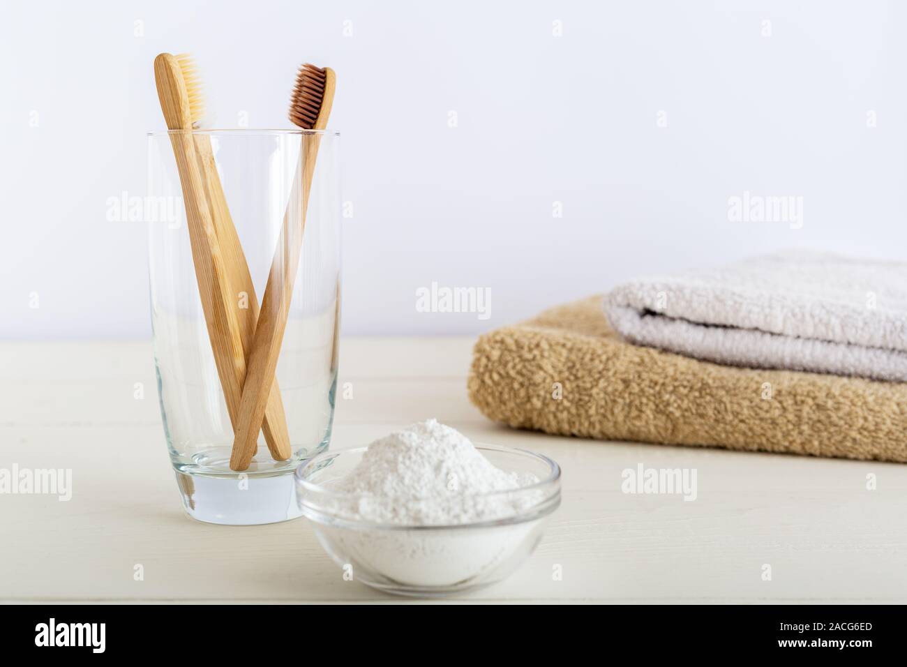 Bamboo toothbrushes, dentifrice tooth powder on white background witn ...