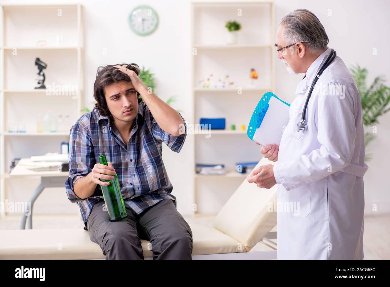 The young male alcoholic visiting old doctor Stock Photo - Alamy
