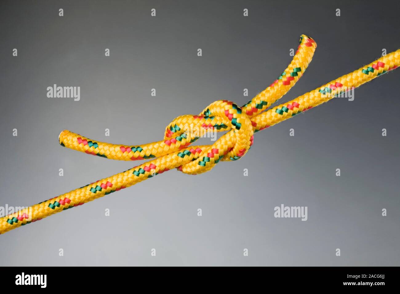Reef knot tied in a rope Stock Photo - Alamy