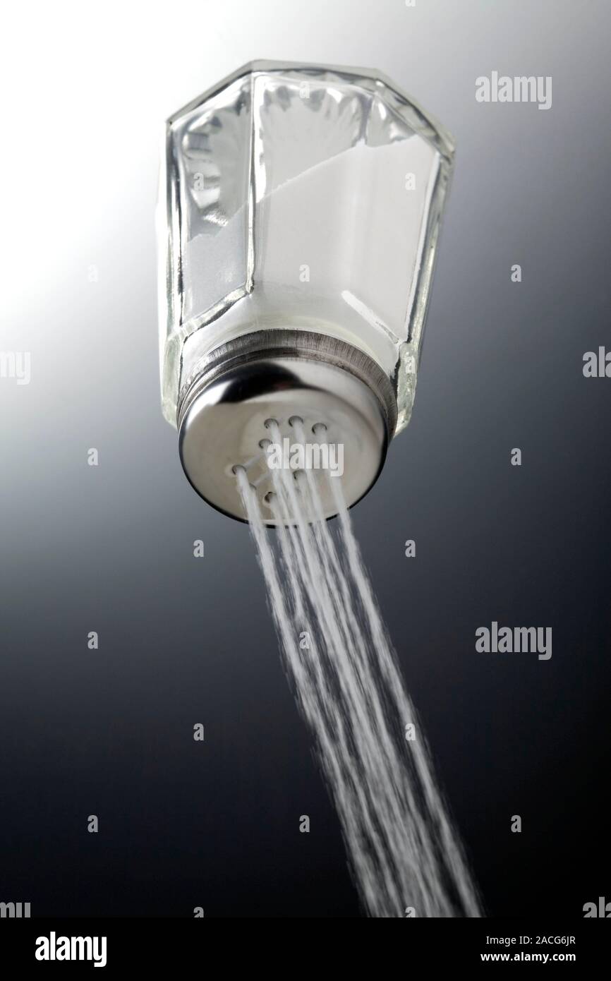 Salt. Table salt being poured from a salt shaker Stock Photo - Alamy