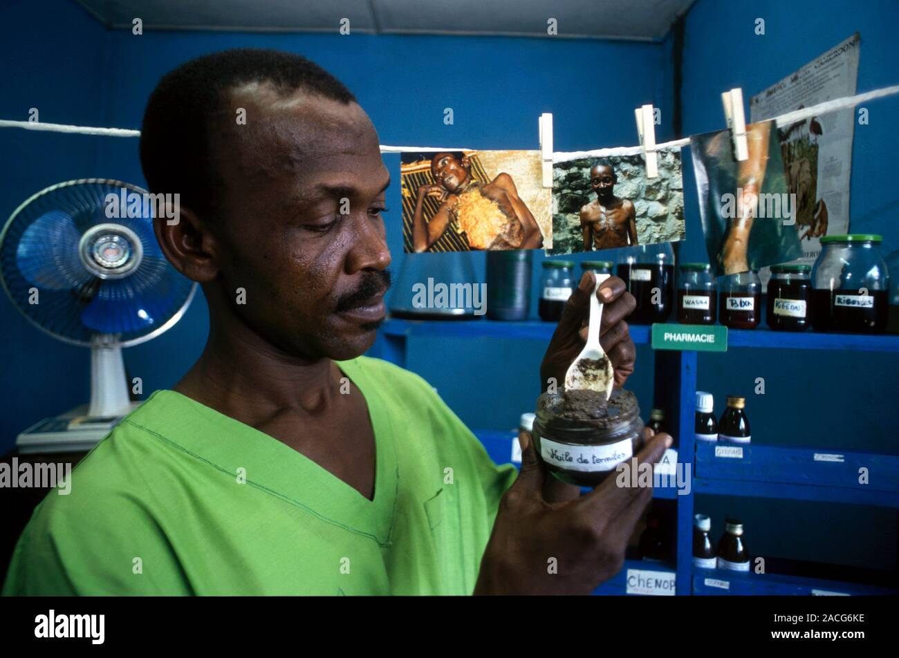 Termite-based medicine. Doctor with a jar containing a medicine made ...