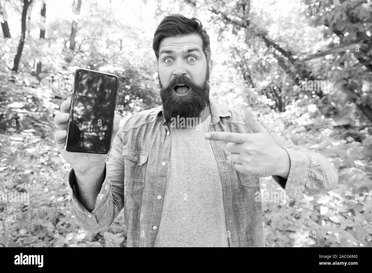 Best GPS and navigation apps. Man bearded wanderer walking in forest ...