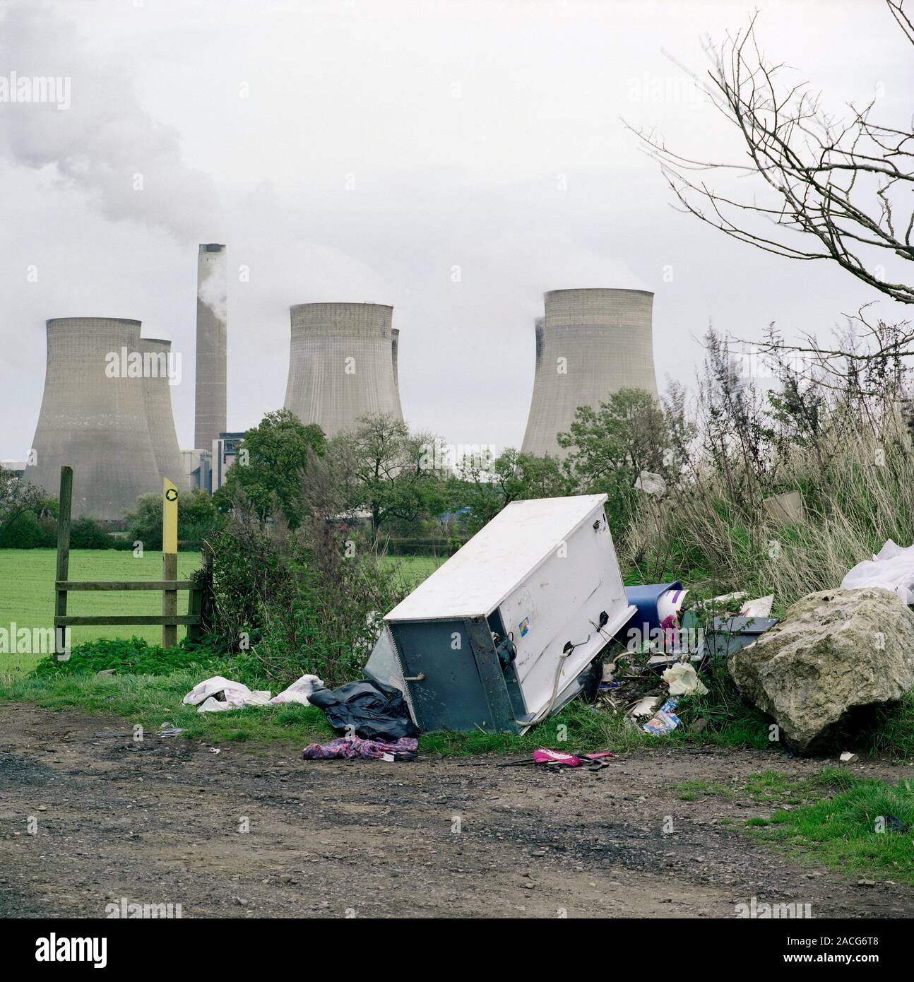 Dumped rubbish in front of the cooling towers of a coal-fire power ...