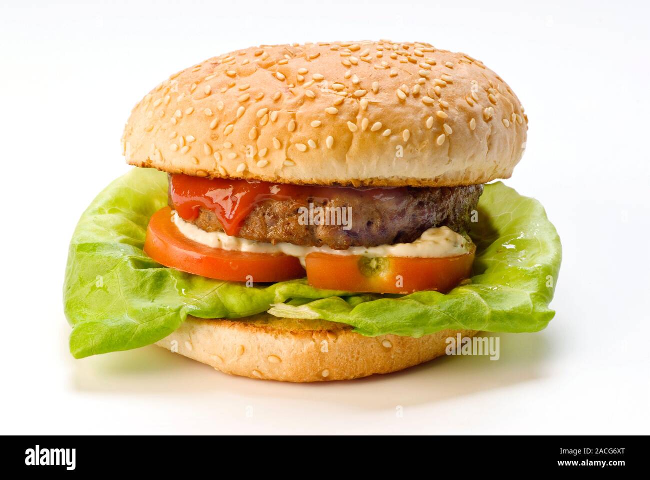 Hamburger. Beef pattie in a bun with salad, relish and ketchup Stock ...
