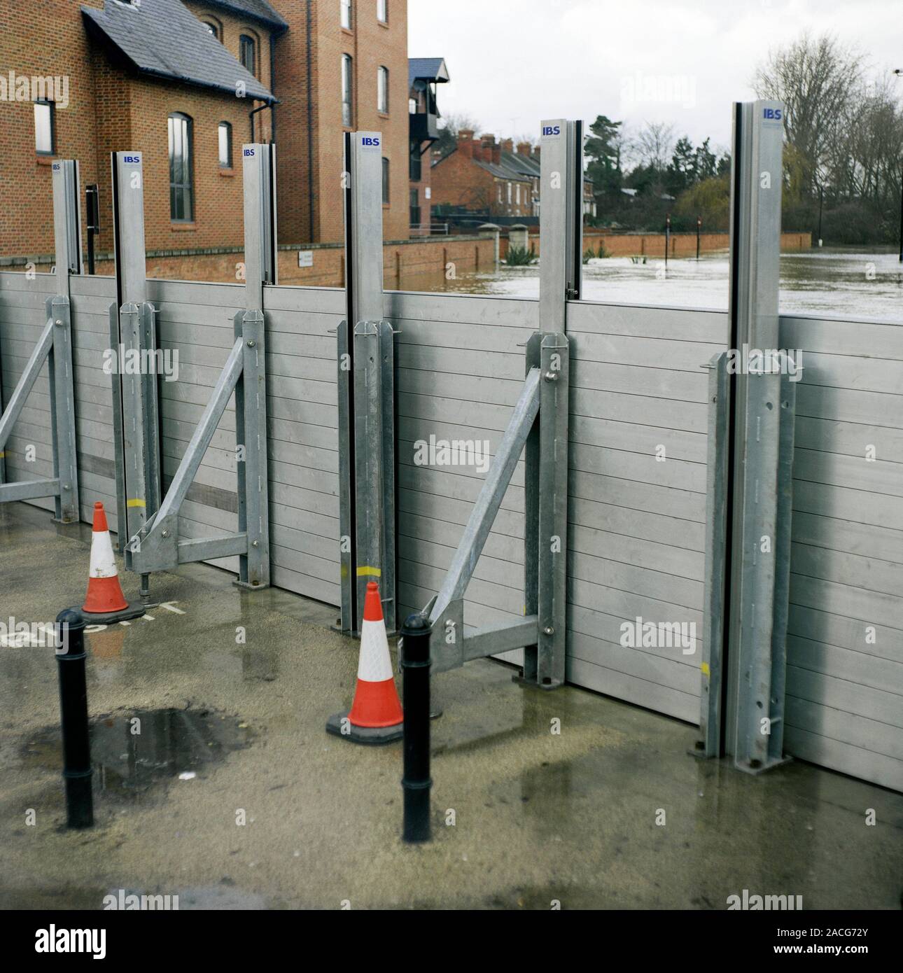 Flood barrier holding back flood water. The water has come from the ...