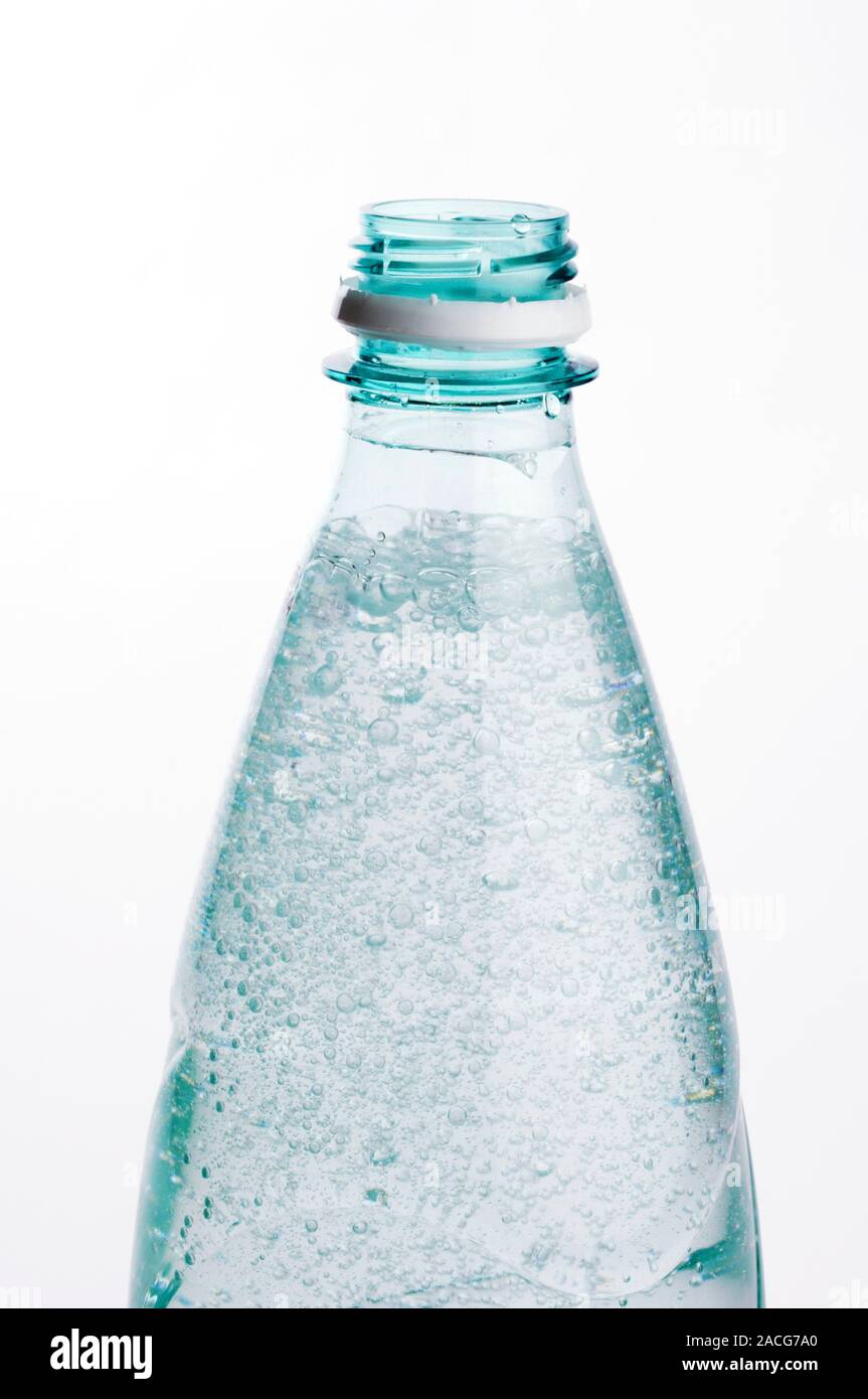 Bottled sparkling water. Open bottle of sparkling drinking water Stock Photo - Alamy