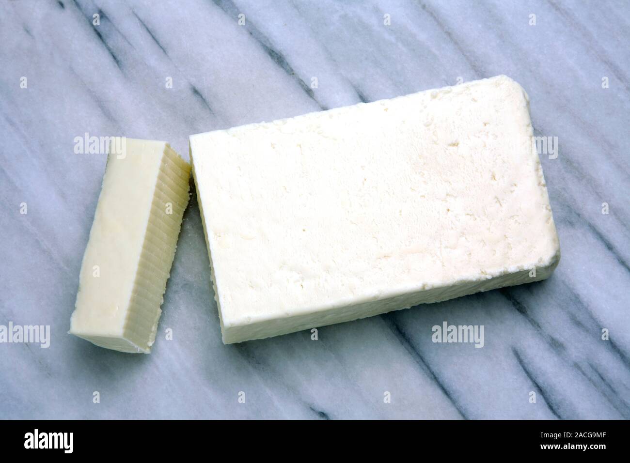 Paneer. Block of the South Asian cheese paneer Stock Photo - Alamy