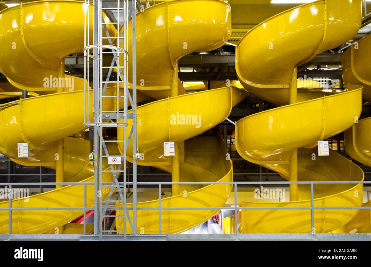 Parcel processing centre. Part of a post sorting machine at the DHL hub ...