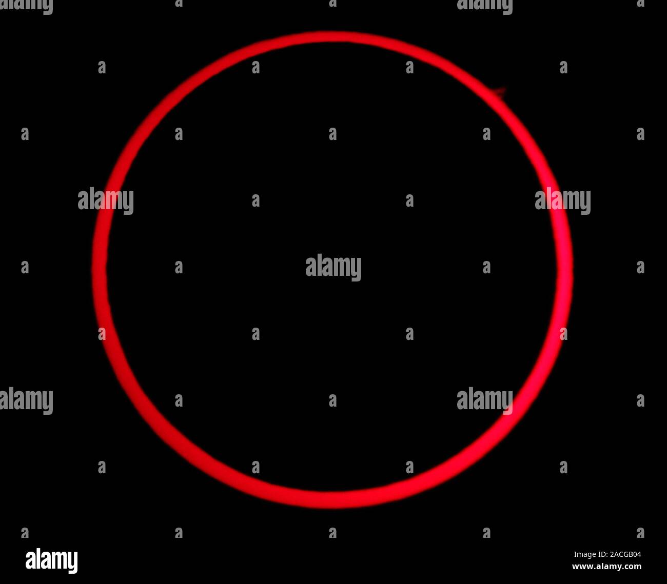 Annular solar eclipse. Solar ring seen around the Moon at the midpoint ...