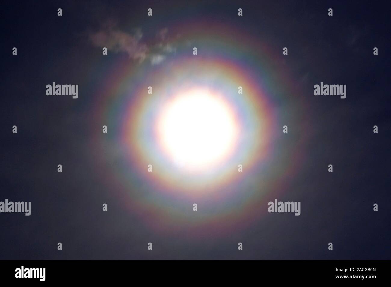 Lunar corona around a gibbous Moon. This phenomenon is caused by the ...