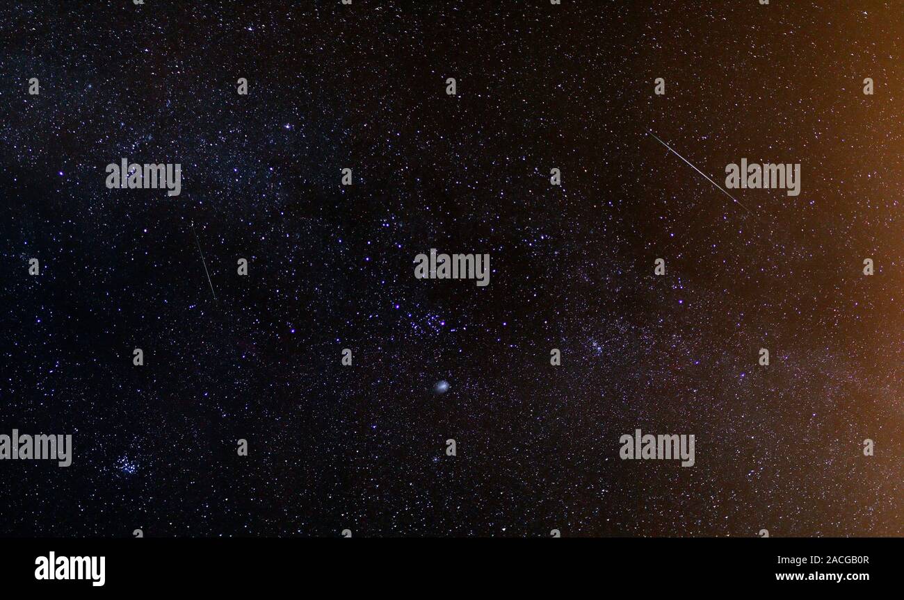 Shooting stars and a comet. Two shooting stars (centre left and upper ...