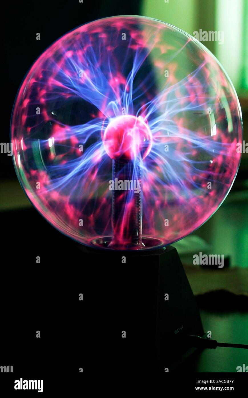 Plasma lamp. Sparks of electricity being generated between a central ...