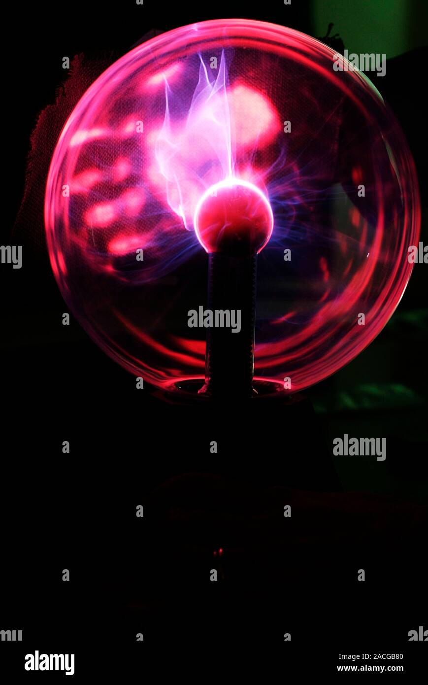 Plasma lamp. Sparks of electricity being generated between a central ...
