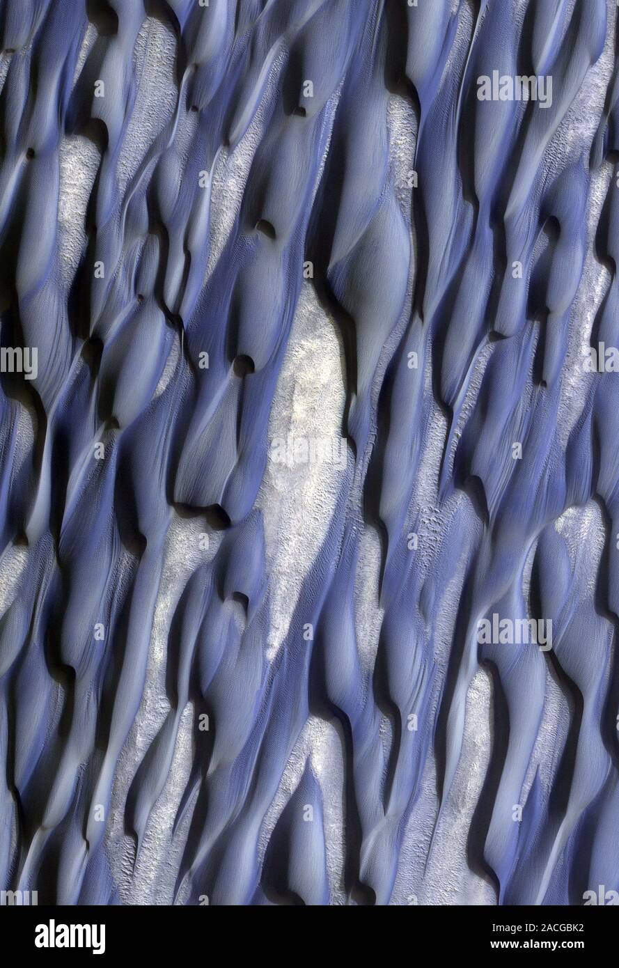 Martian sand dunes. Coloured satellite image of sand dunes in the ...