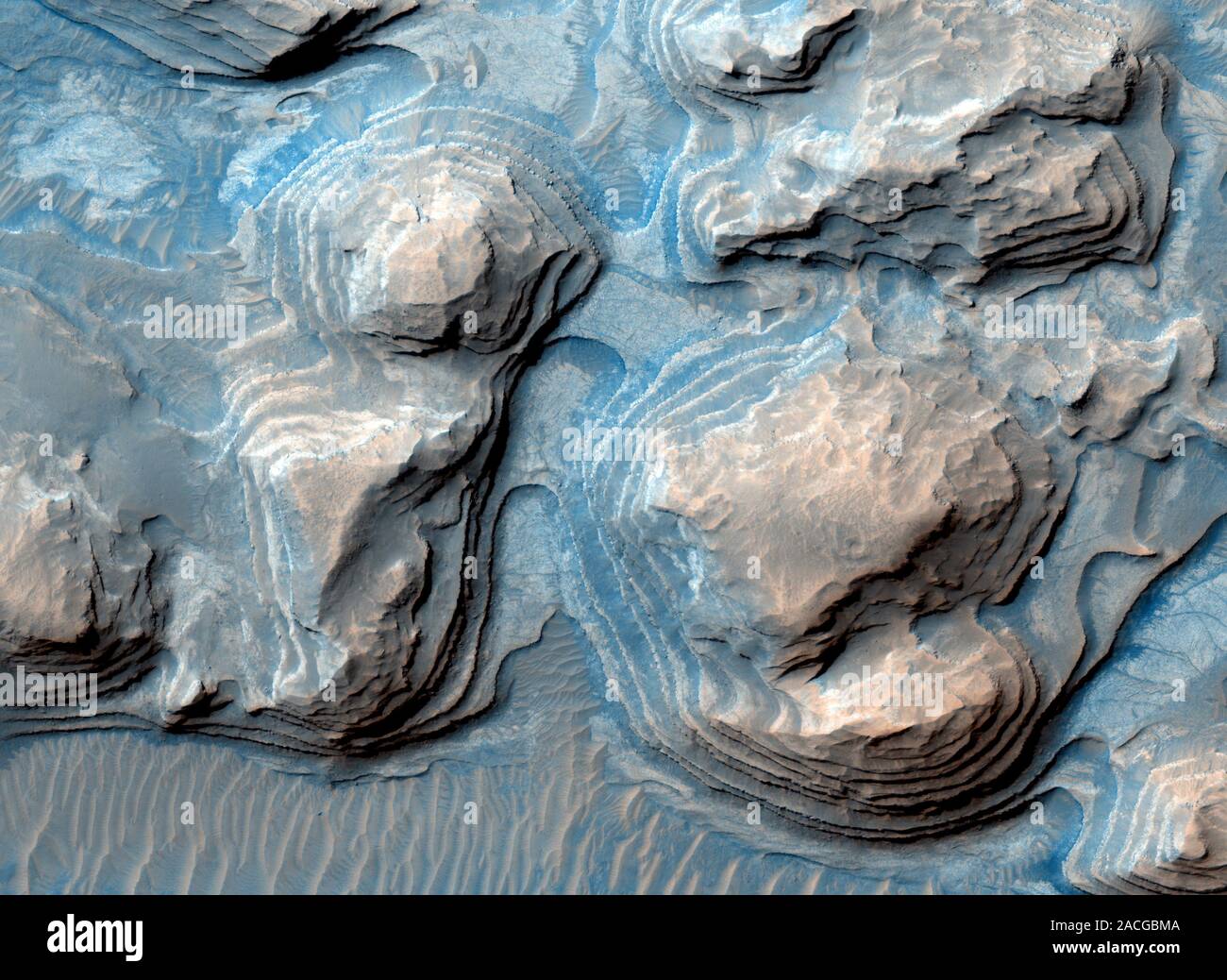 Layered Martian terrain. Coloured satellite image of layered rocks in ...