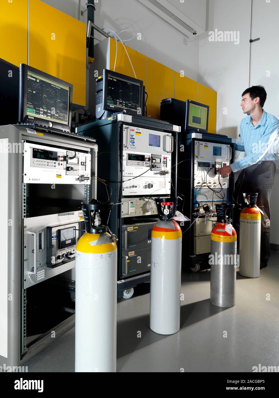 Gas cylinder analysis. Gas cylinders connected to analysis machines ...