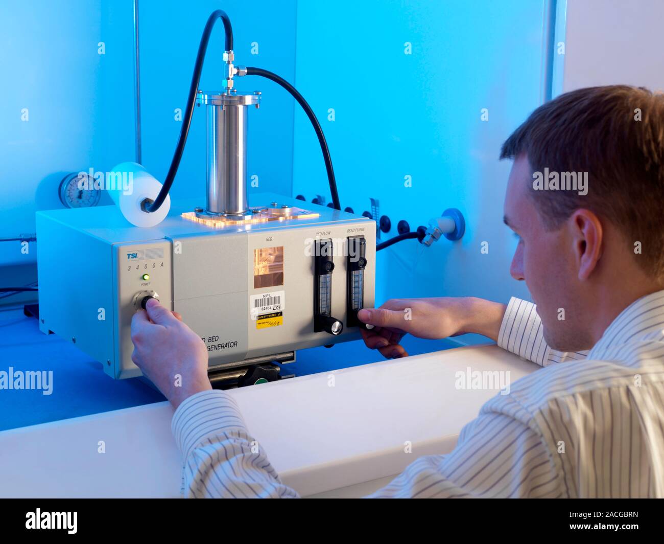 Airborne nanoparticle metrology. Scientist using specialist equipment ... Airborne nanoparticle metrology. Scientist using specialist equipment ...