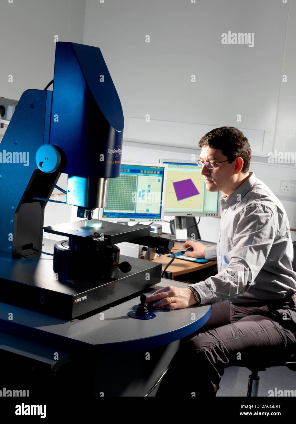 Optical coherence tomography. Scientist using an optical coherence ...