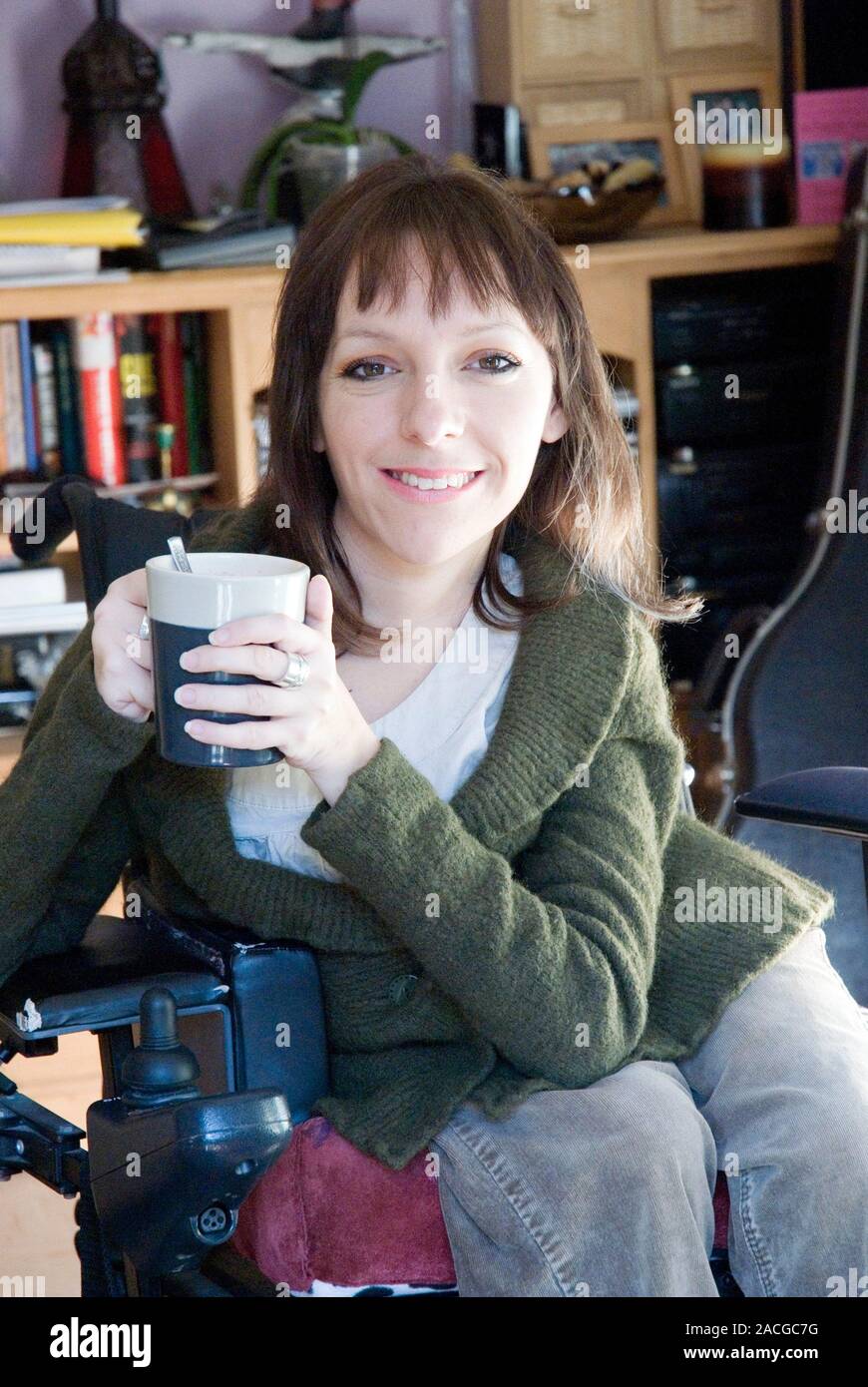 Woman with spinal muscular atrophy in a wheelchair. Spinal muscular ...