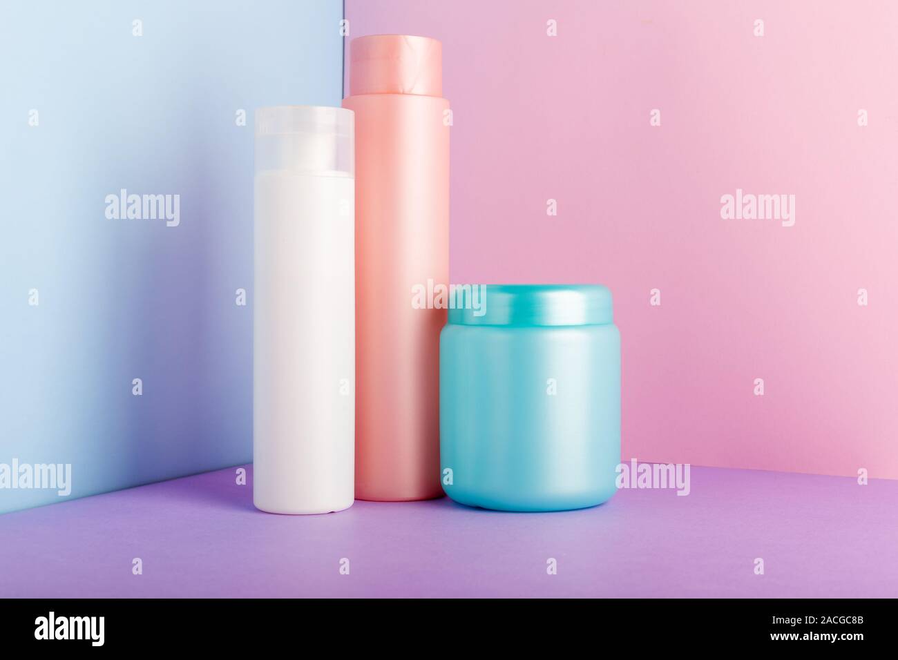 Set of cosmetic products on pink background. Cosmetic package ...