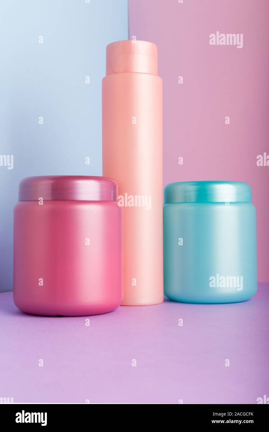 Set of cosmetic products on pink background. Cosmetic package ...