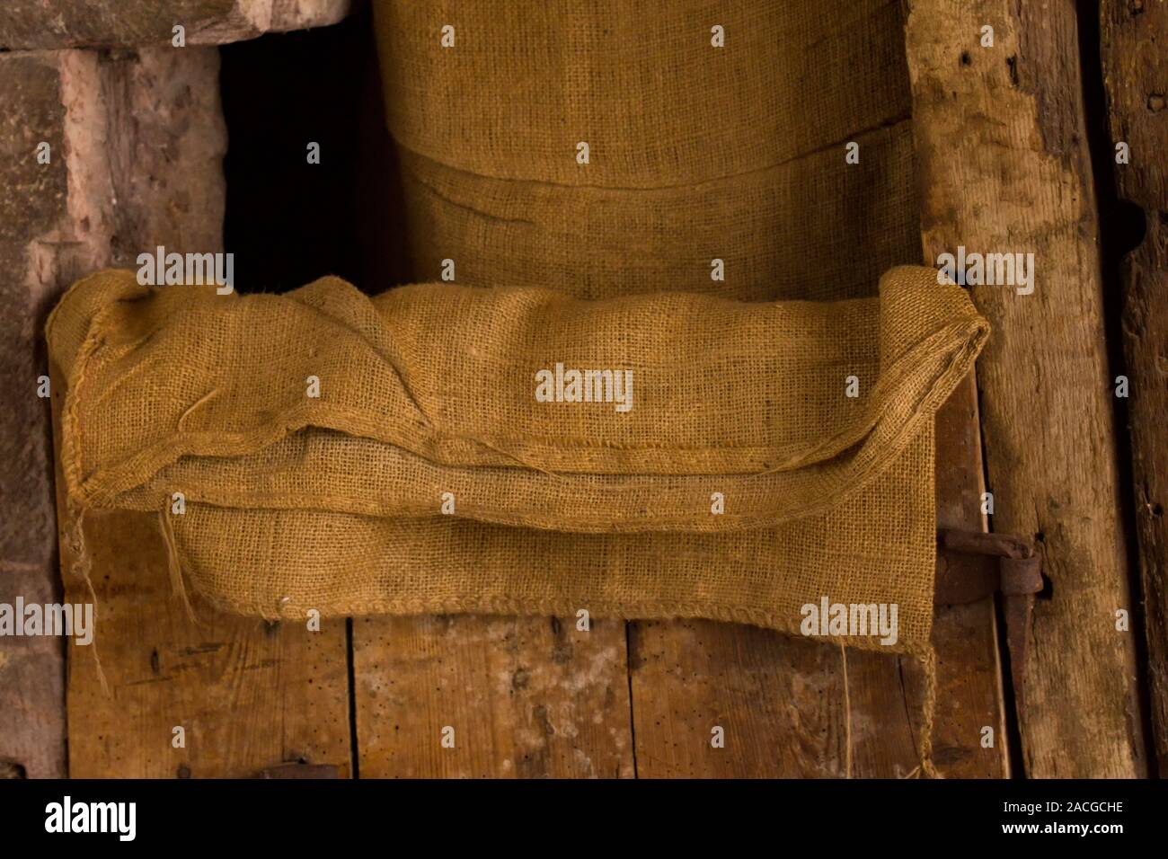 old gunnysack hanging on a barn door Stock Photo - Alamy