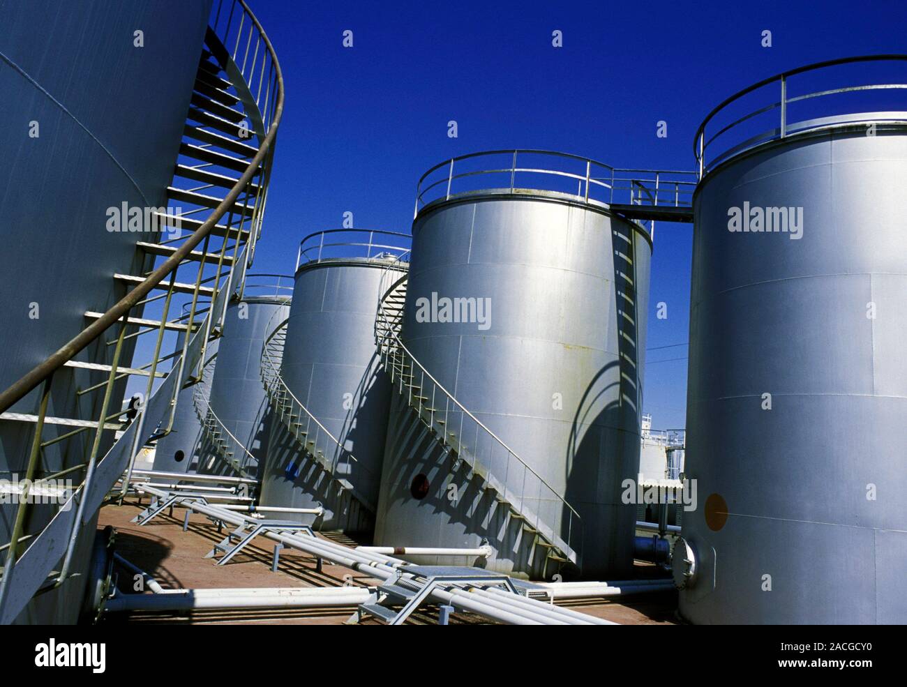Oil refinery. Storage tanks containing petroleum products at a ...